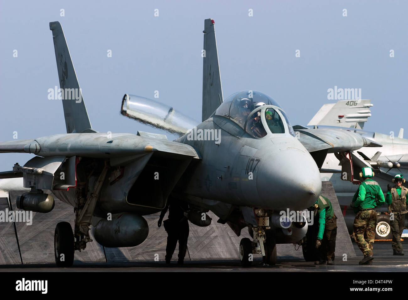 An F-14D Tomcat in launch position on the flight deck of USS Theodore ...