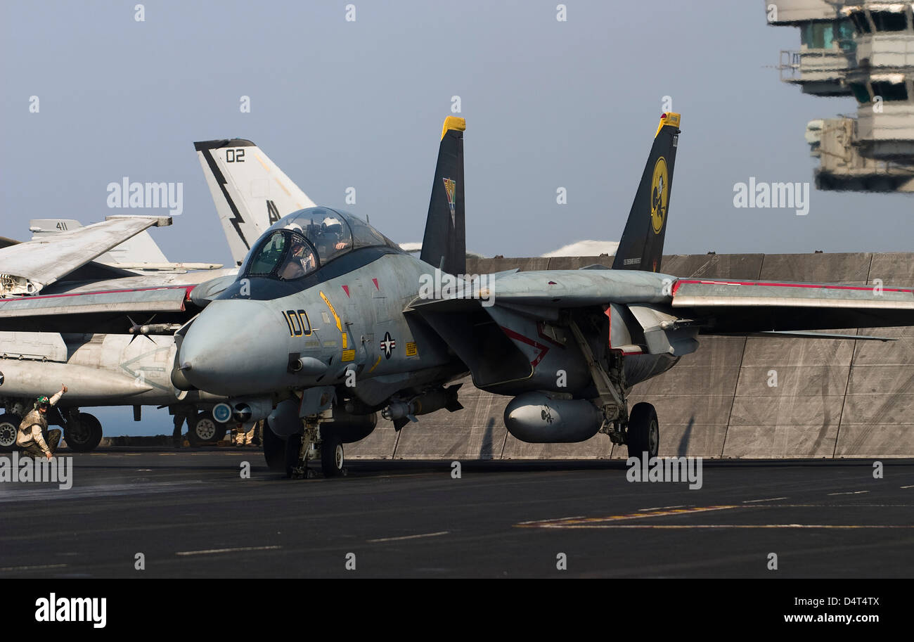 An F-14D Tomcat in launch position on the flight deck of USS Theodore ...