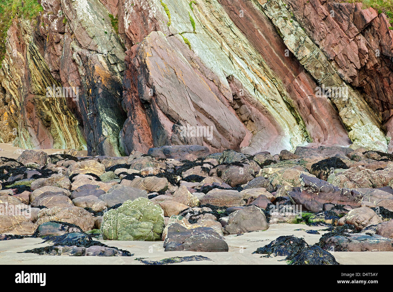 Rock and cliff faces with a varied geology at marloes sands beach ...