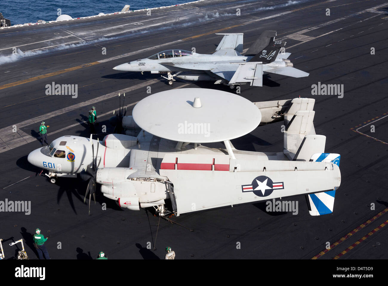 An E-2C Hawkey and an F/A-18 Super Hornet aboard USS Dwight D ...