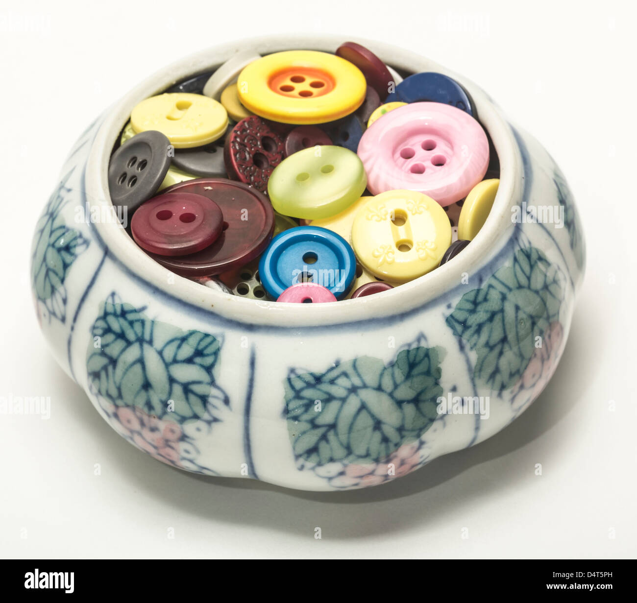 decorative glass container of clothing buttons Stock Photo - Alamy