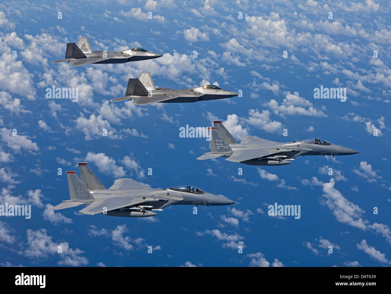 Two F-15 Eagles and F-22 Raptors fly in formation Stock Photo - Alamy