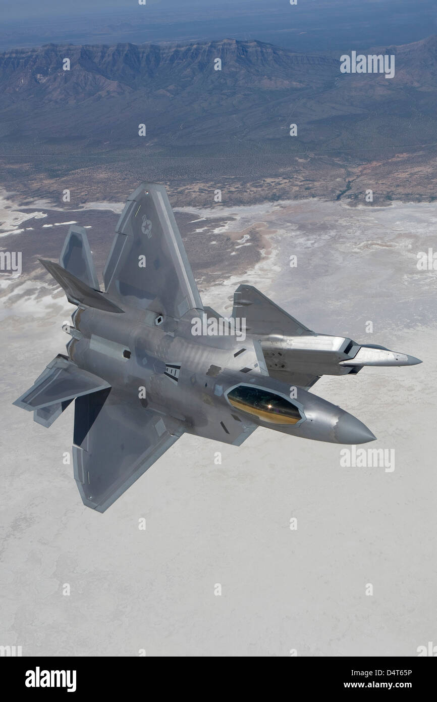 Two F-22 Raptors from the 49th Fighter Wing manuever while on a ...
