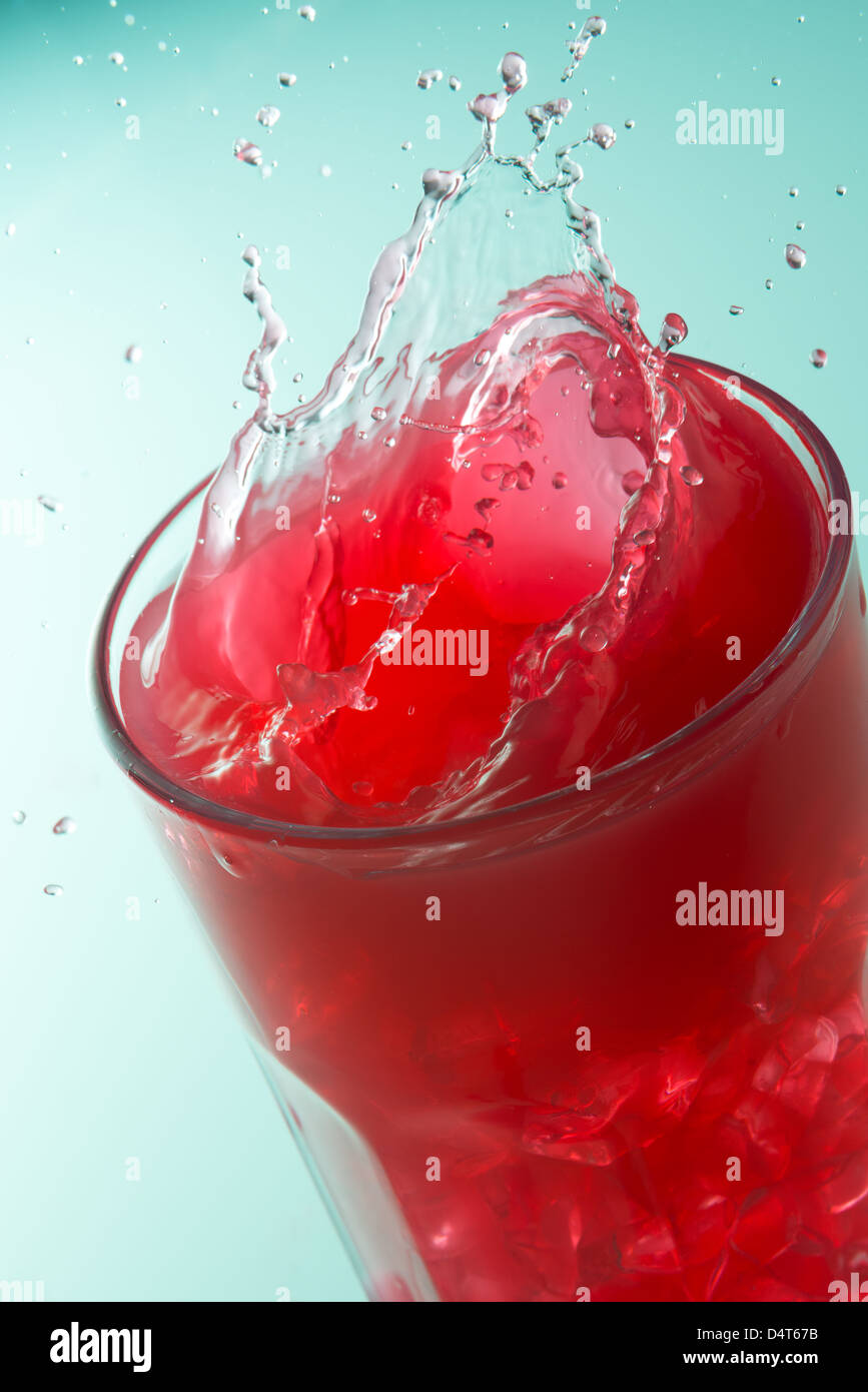 Close up of a splash on a glass of strawberry juice Stock Photo - Alamy