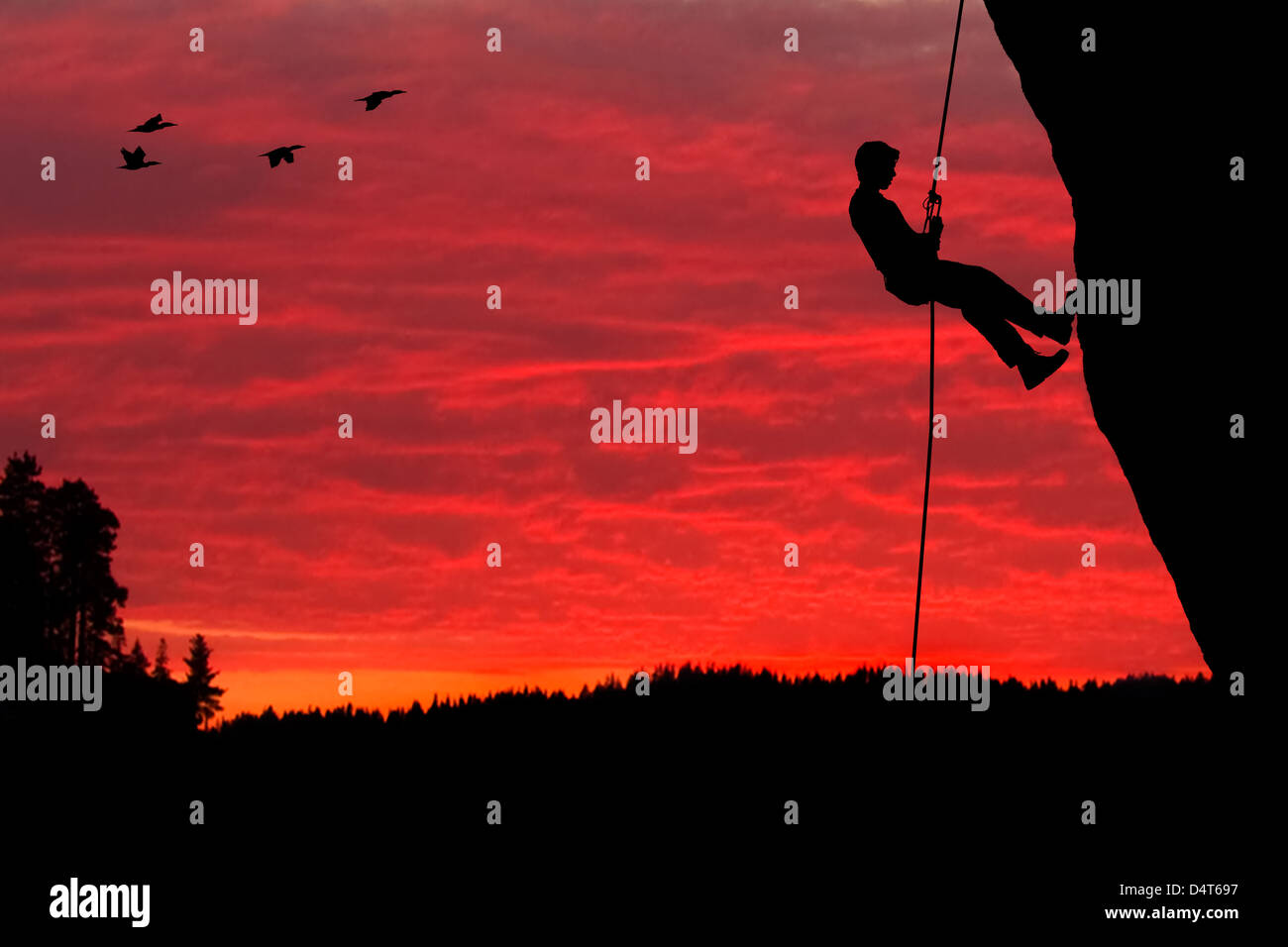 Rock Climber Rappelling Silhouette Stock Photo - Alamy