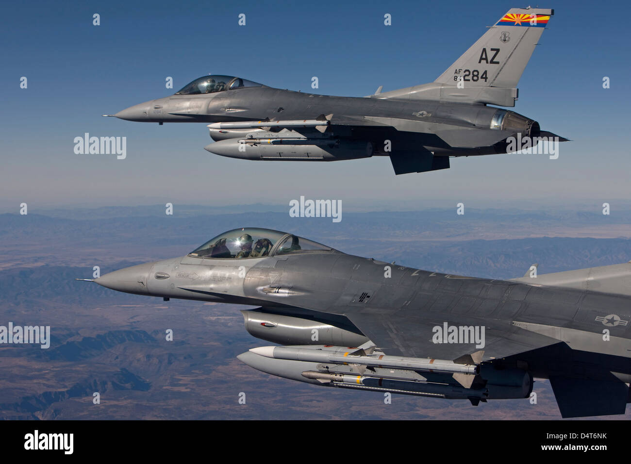 A pair of F-16's from the 162nd Fighter Wing fly in formation during a ...