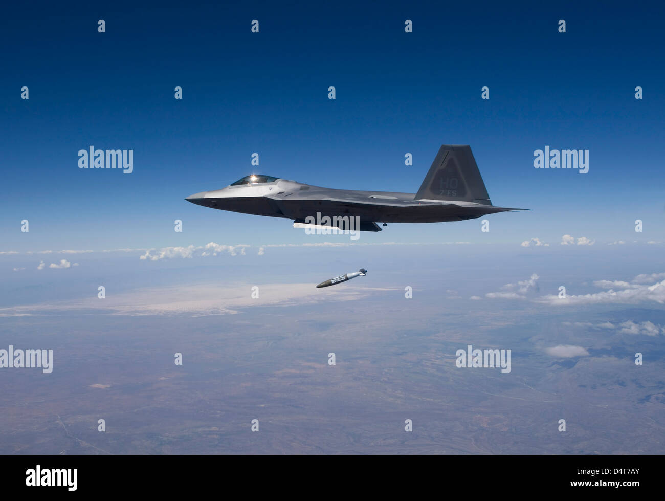 An F-22 Raptor releases a GBU-32 JDAM on a training mission out of ...