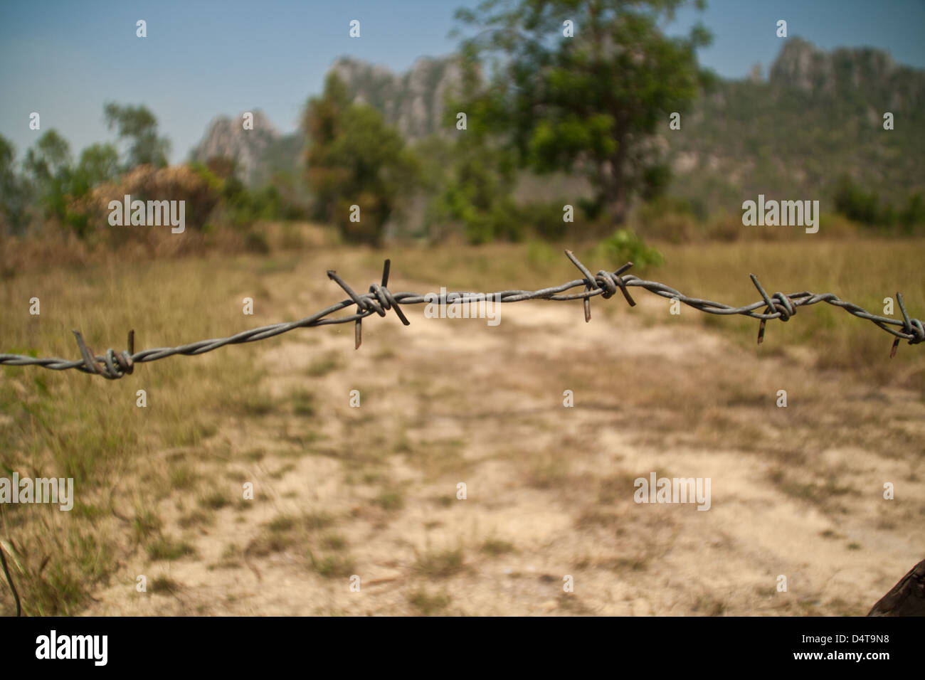 Sharp barbed wire corrosion, prevent the invasion Stock Photo - Alamy