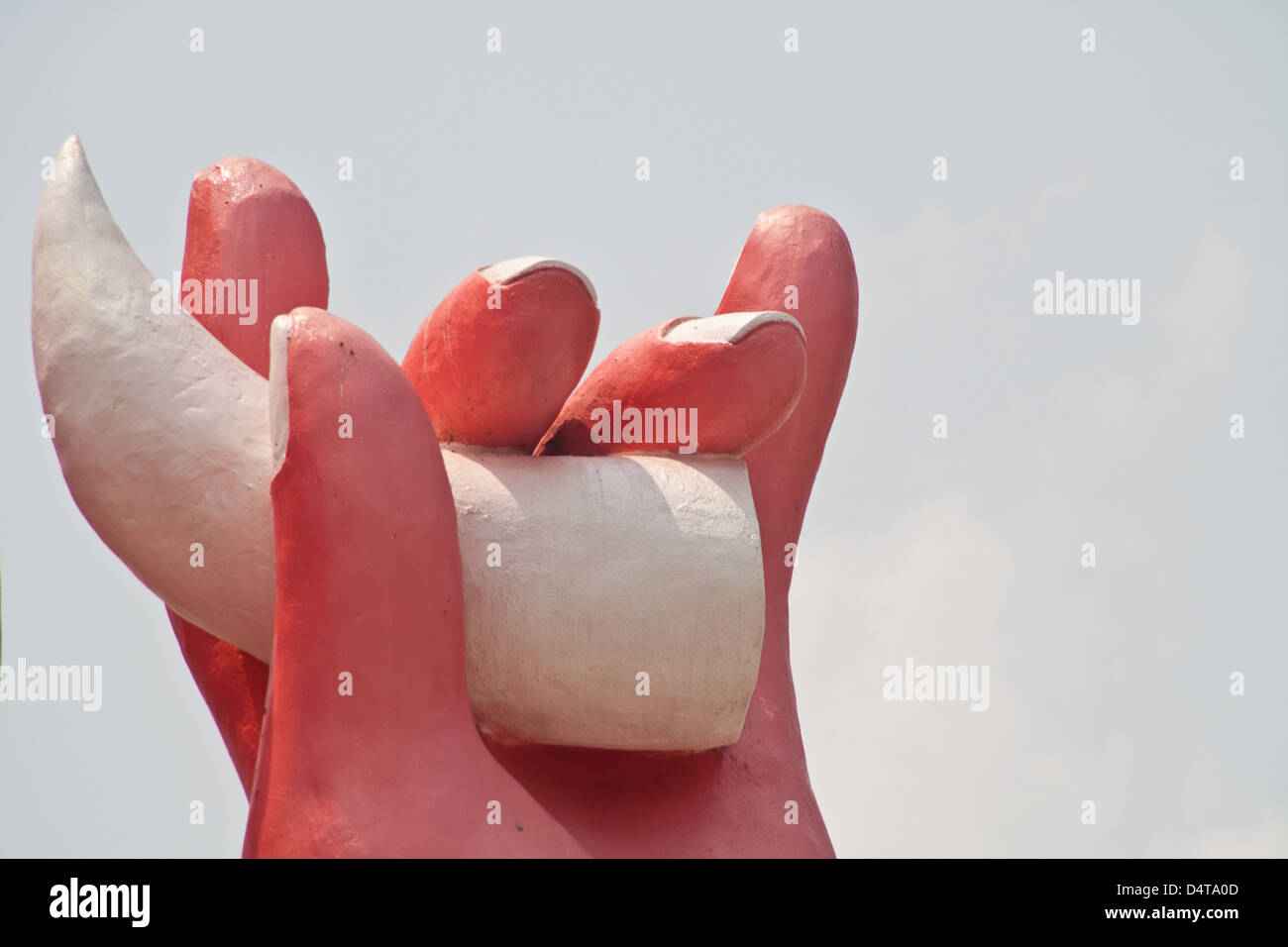 Hand Ganesh holding hands ivory, color pink Stock Photo - Alamy