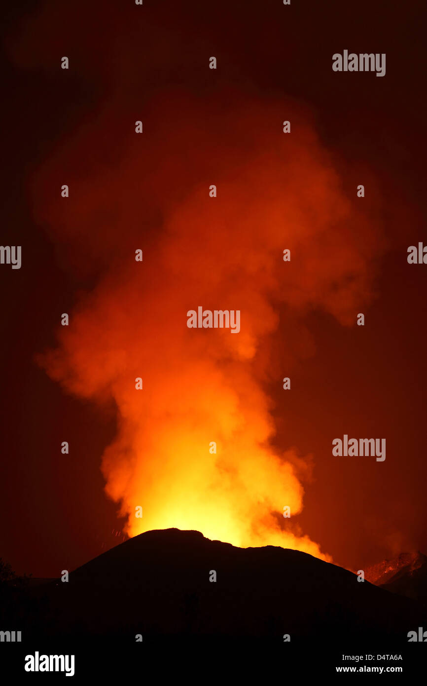 January 22, 2012 - Glowing lava in crater illuminating gas cloud above ...