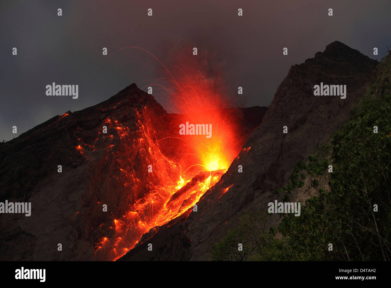 Strombolian type eruption of Batu Tara volcano, Indonesia Stock Photo ...