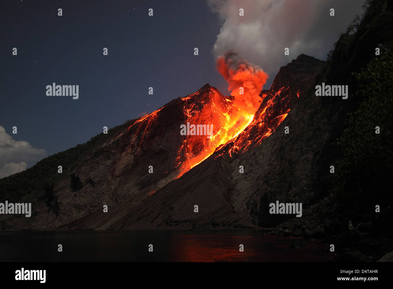 Strombolian type eruption of Batu Tara volcano, Indonesia Stock Photo ...