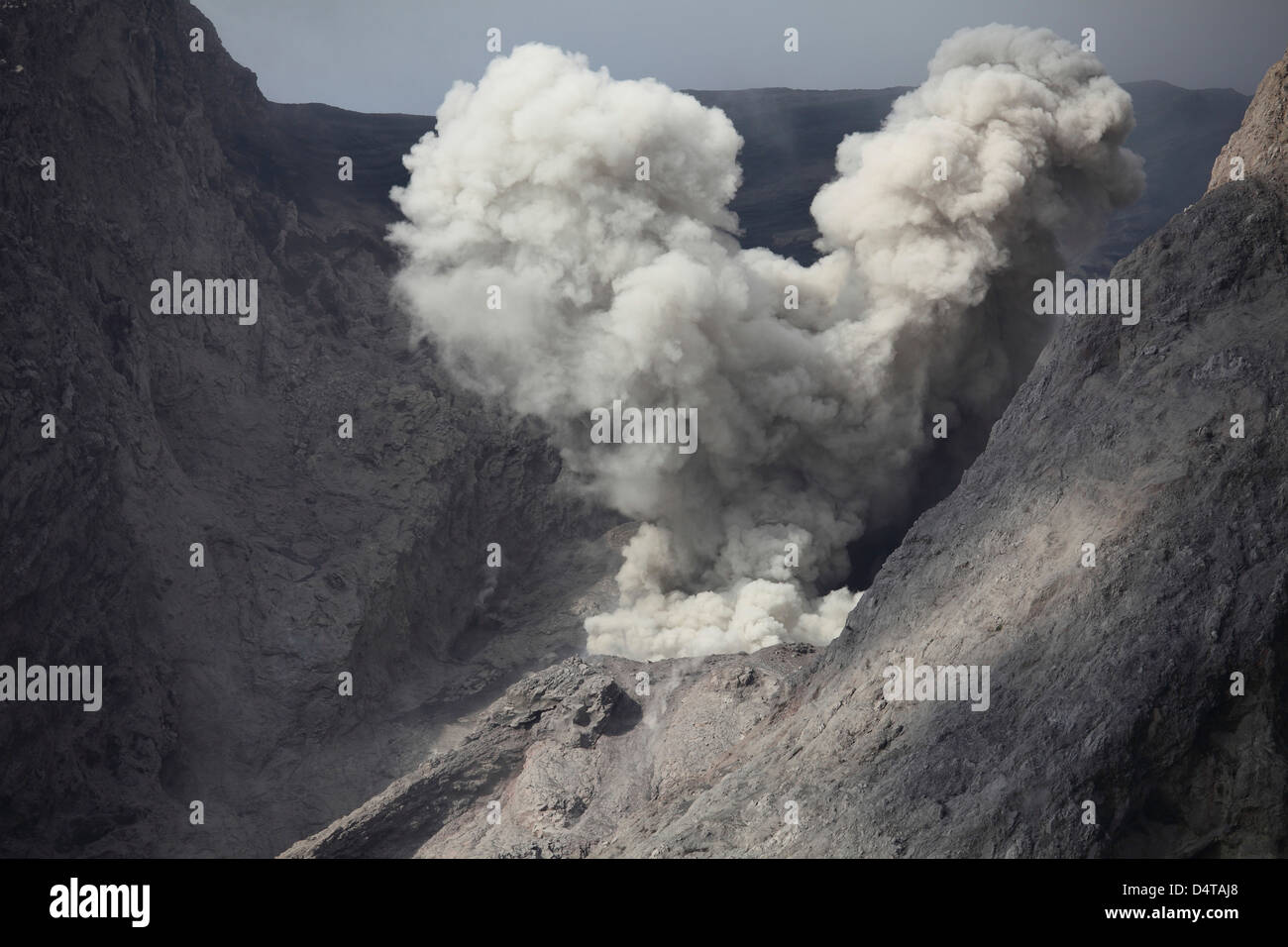 Ash cloud rises from crater of Batu Tara volcano, Indonesia Stock Photo ...