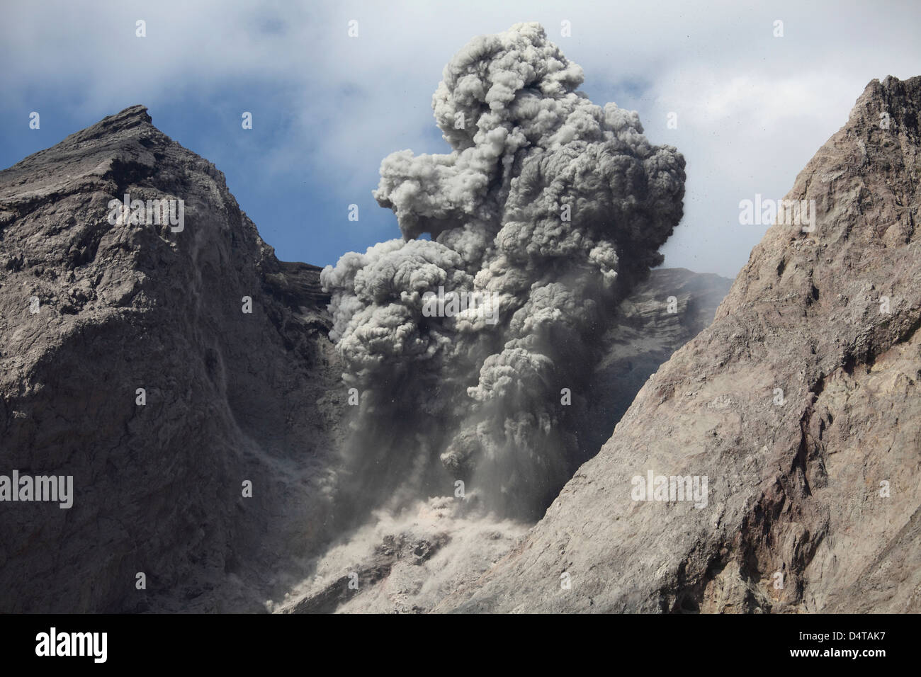 Ash cloud rises from crater of Batu Tara volcano, Indonesia Stock Photo ...