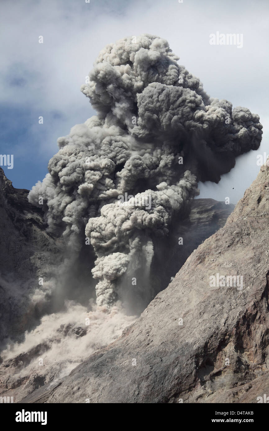 Ash cloud rises from crater of Batu Tara volcano, Indonesia Stock Photo ...