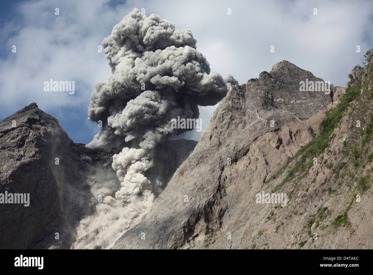 Ash cloud rises from crater of Batu Tara volcano, Indonesia Stock Photo ...