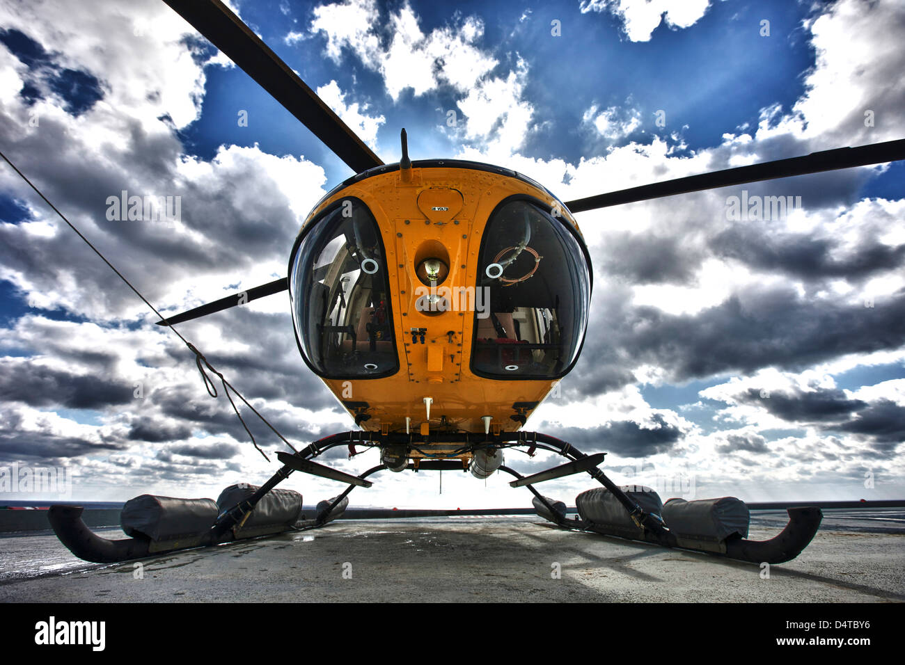 A Bell 407 utility helicopter on the helipad of an oil rig Stock Photo ...