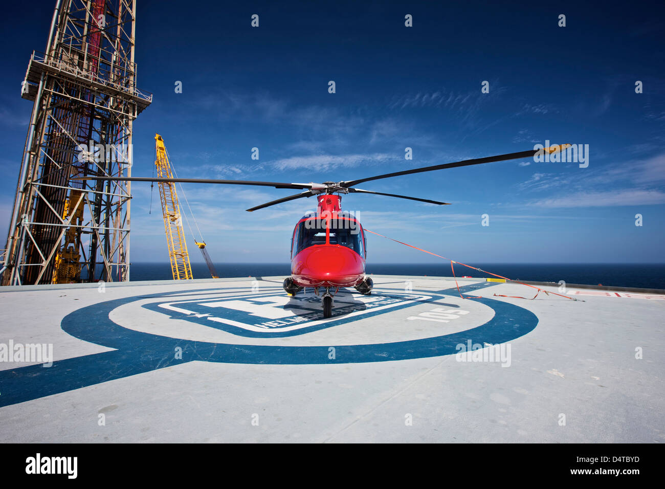 AgustaWestland AW109E helicopter parked on the helipad of an oil rig in ...