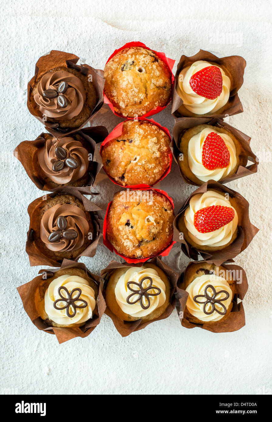 A colourful selection of muffins and cupcakes Stock Photo - Alamy