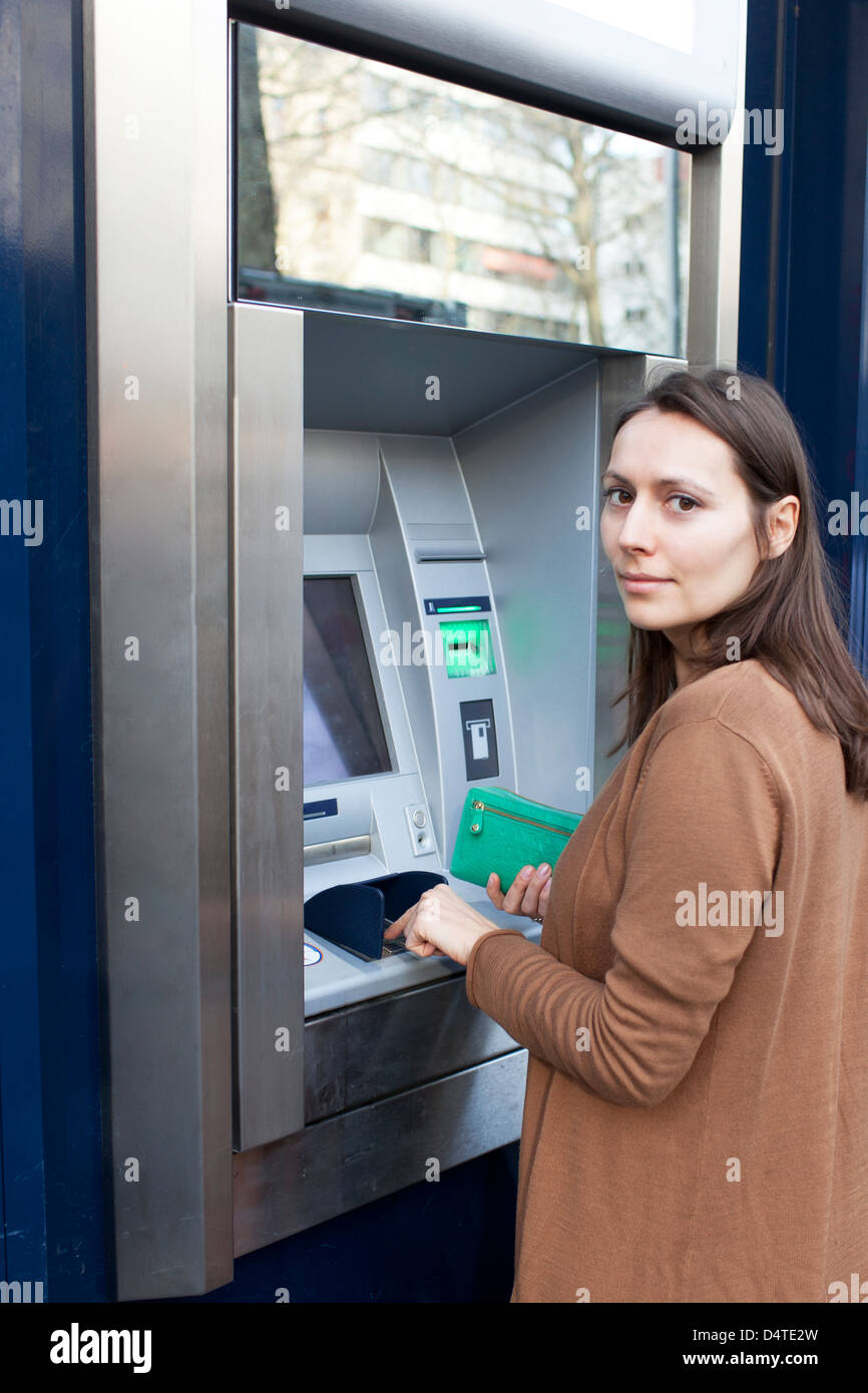 Woman at the ATM Stock Photo - Alamy