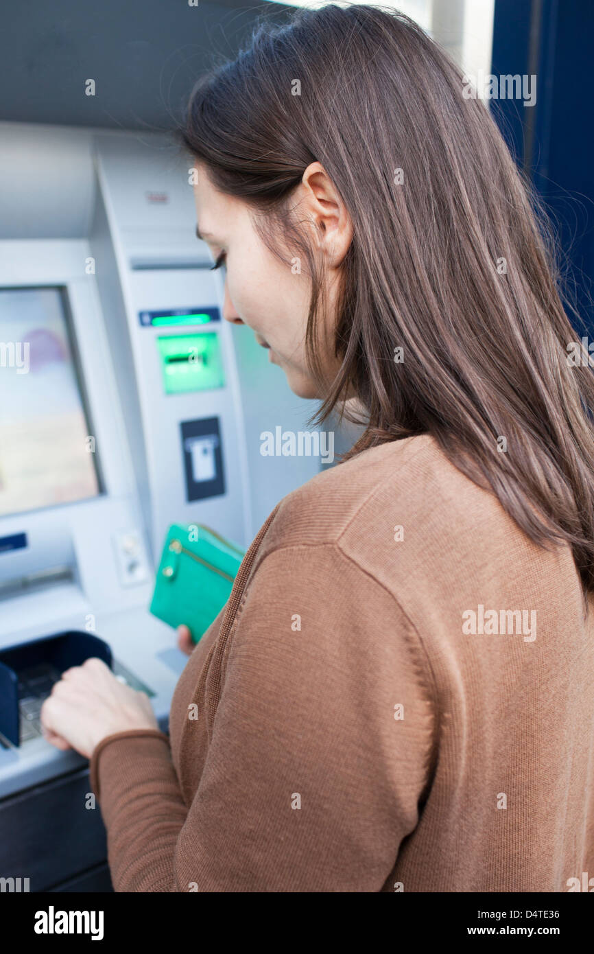 Woman at the ATM Stock Photo - Alamy