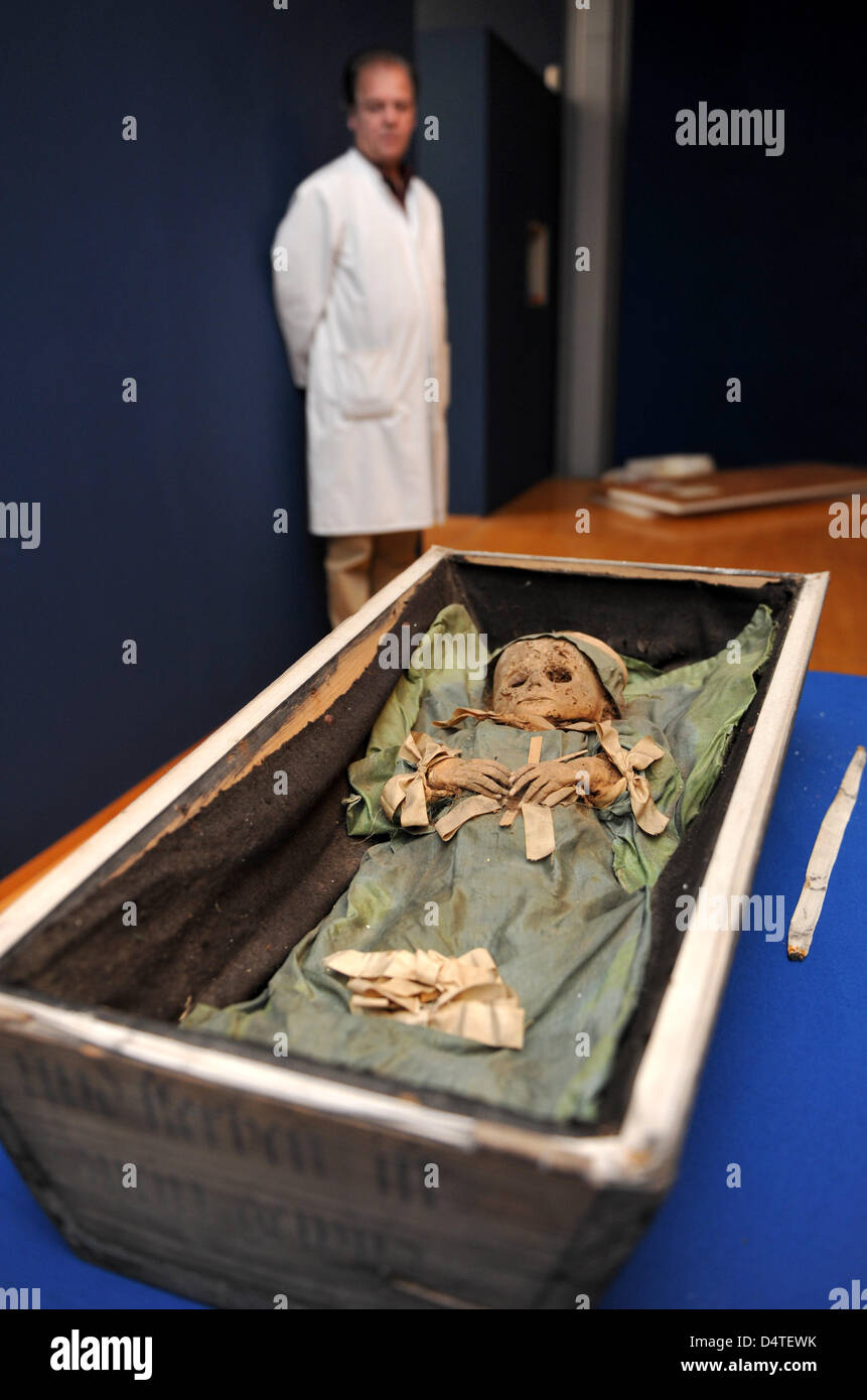 The mummy of a six-month-old child who died in 1637 is seen at the ...