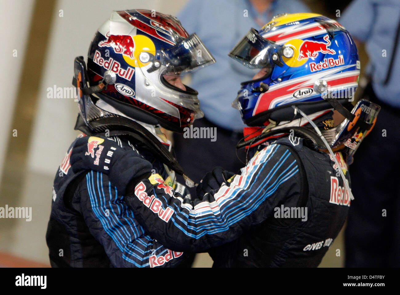 German Formula One driver Sebastian Vettel of Red Bull Racing (L) hugs ...