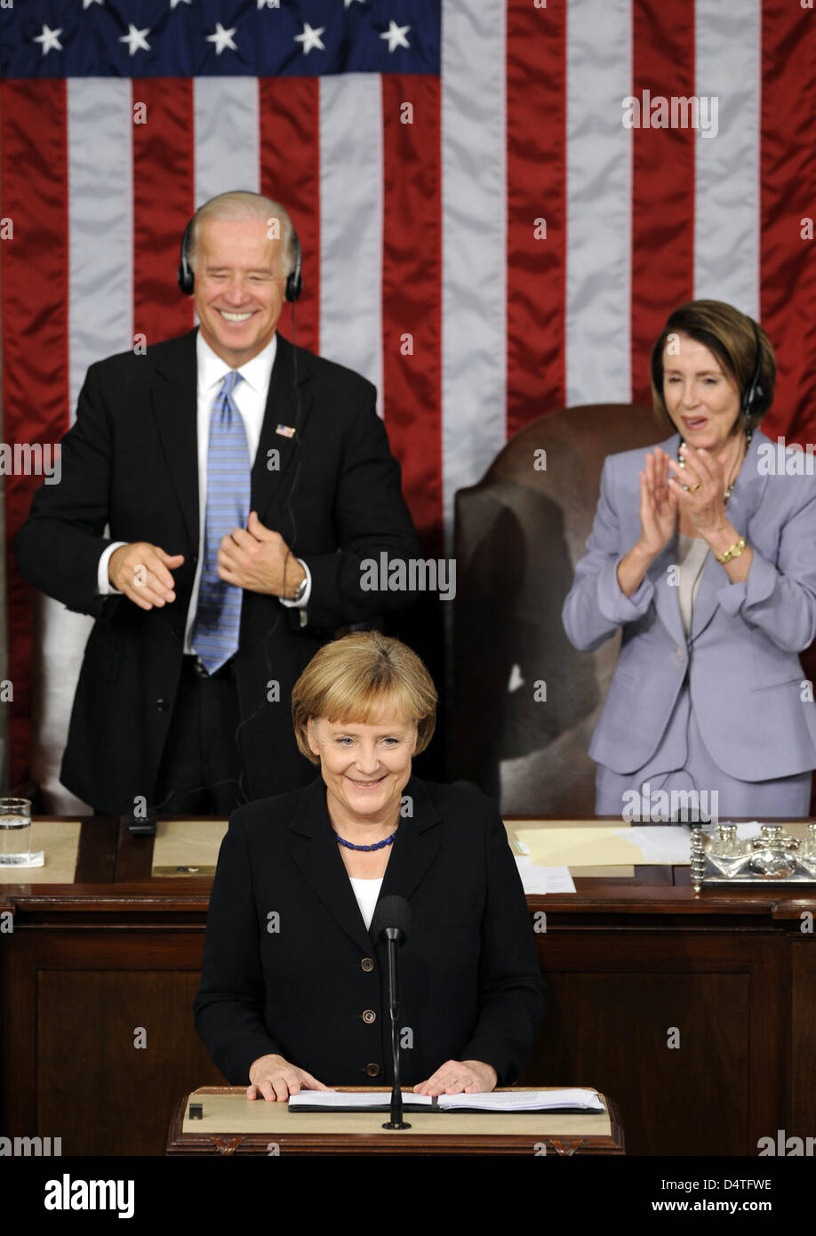 German Chancellor Angela Merkel (C) smiles after her speech to the US ...