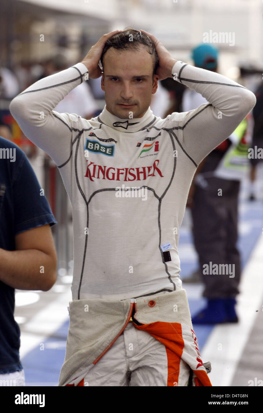 Italian Formula One driver Vitantonio Liuzzi of Force Inida walks ...