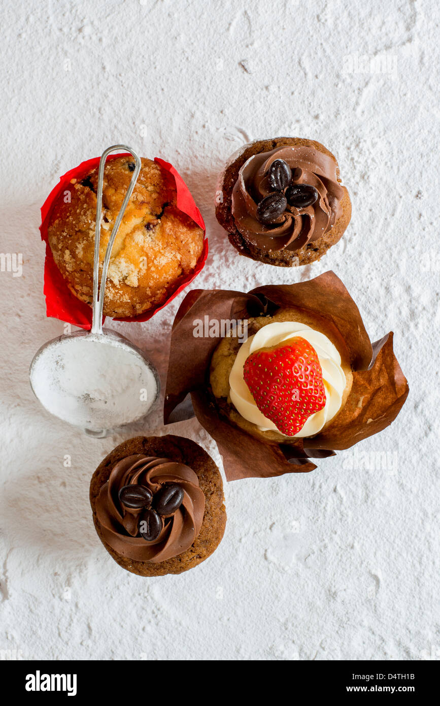 A selection of colourful muffins and cupcakes Stock Photo - Alamy