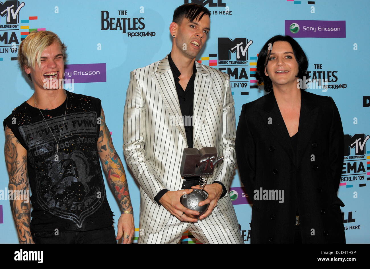 Members of the British band Placebo pose with the award in the category ...