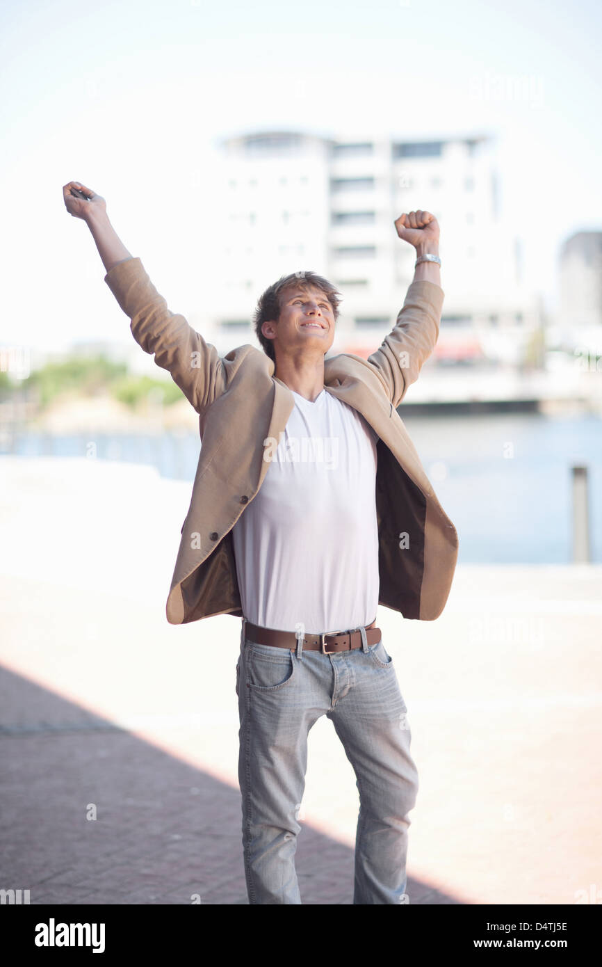 Businessman cheering outdoors Stock Photo - Alamy