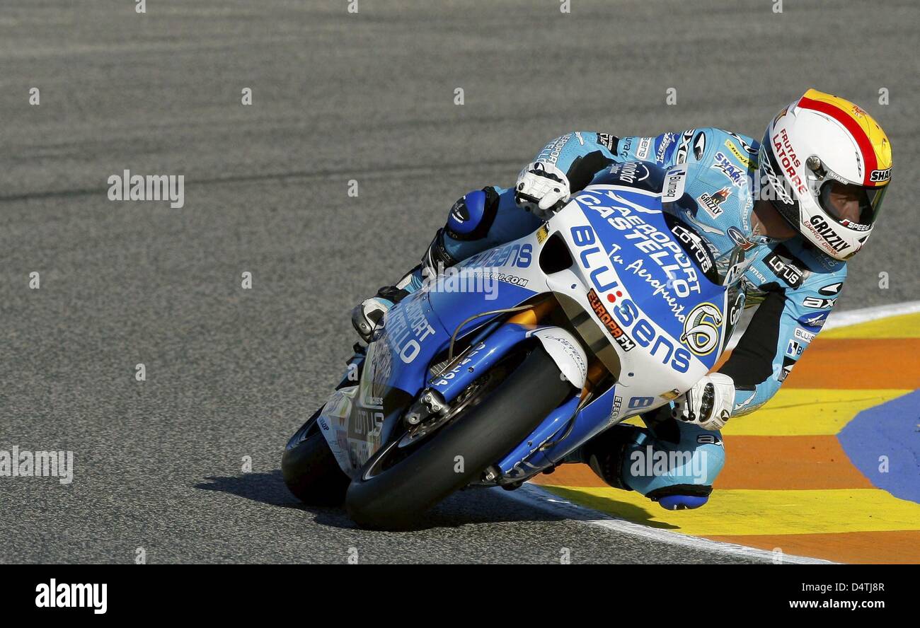 Spanish motor racer Alex Debon on Aprilla steers his bike during the ...