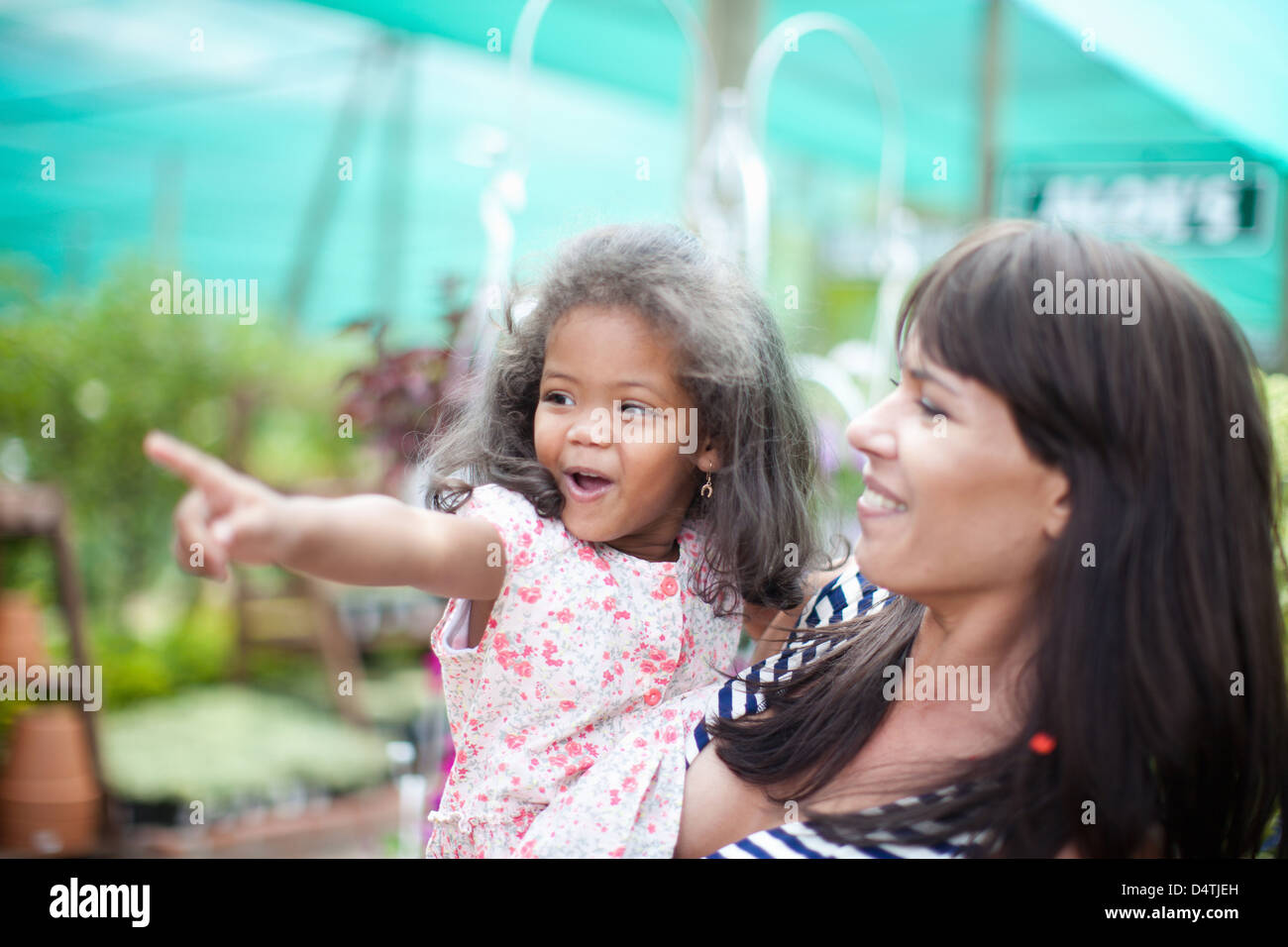 Mother and daughter pointing Stock Photo - Alamy