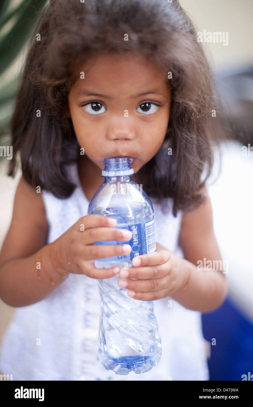 Girl drinking out of water bottle Stock Photo - Alamy