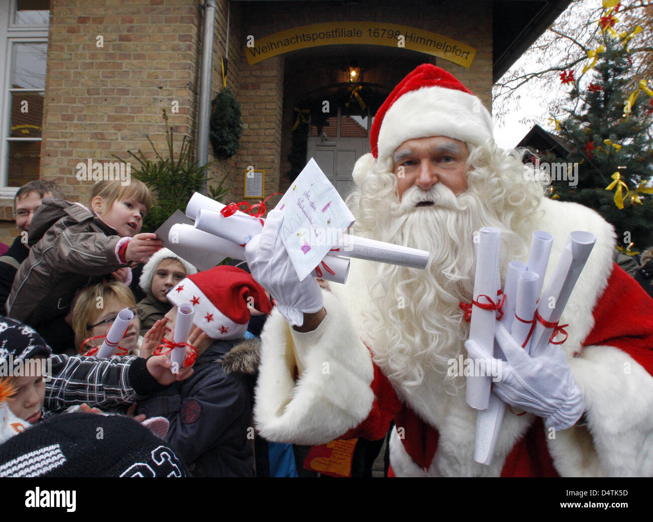 Santa Claus receives christmas wishes from children during the opening ...