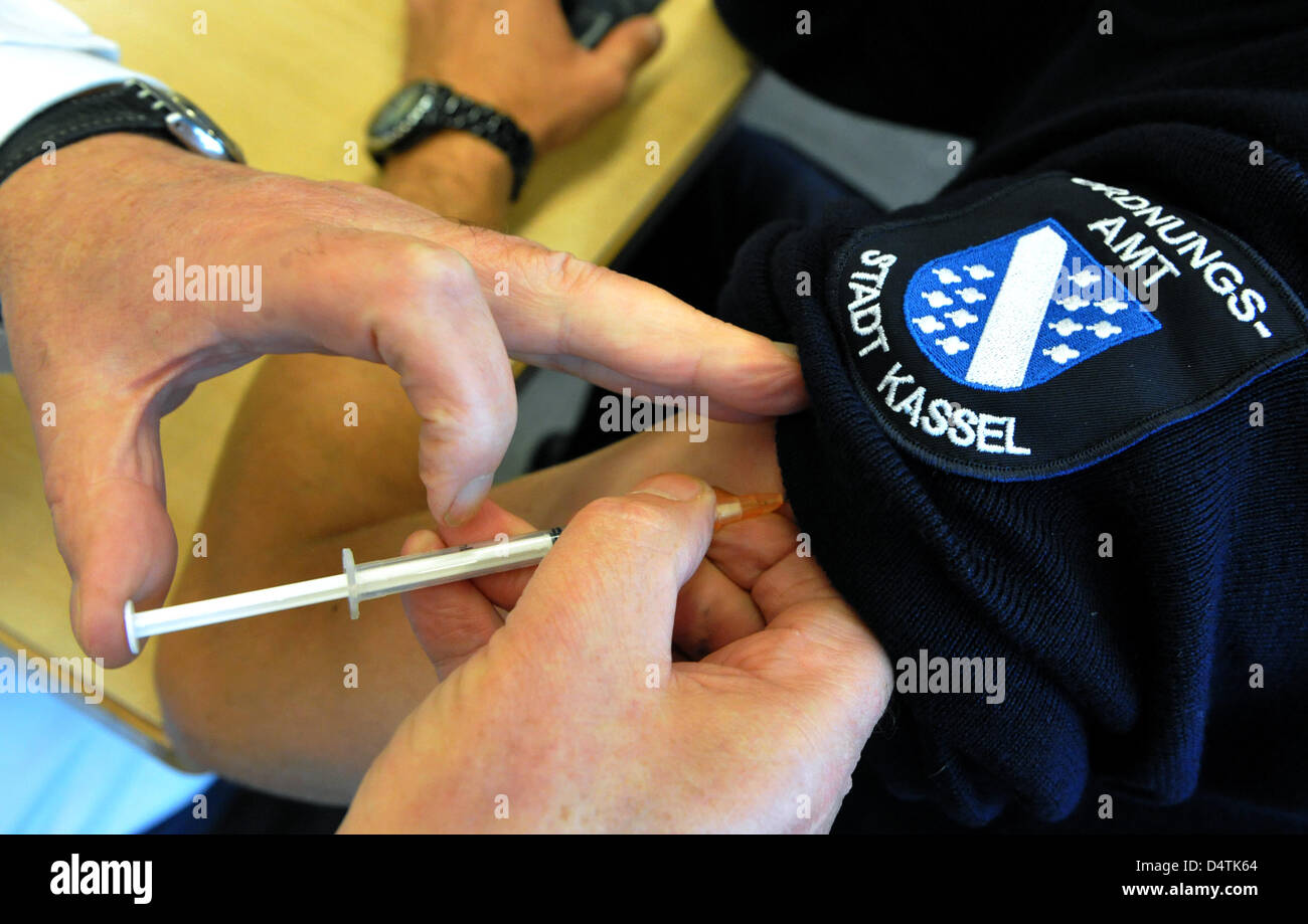 A member of the communal services receives a ?Pandemrix? vaccine ...