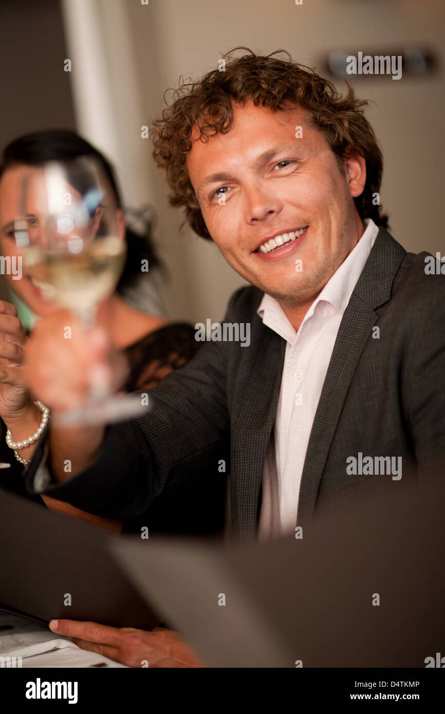 Young smiling businessman toasting hi-res stock photography and images ...