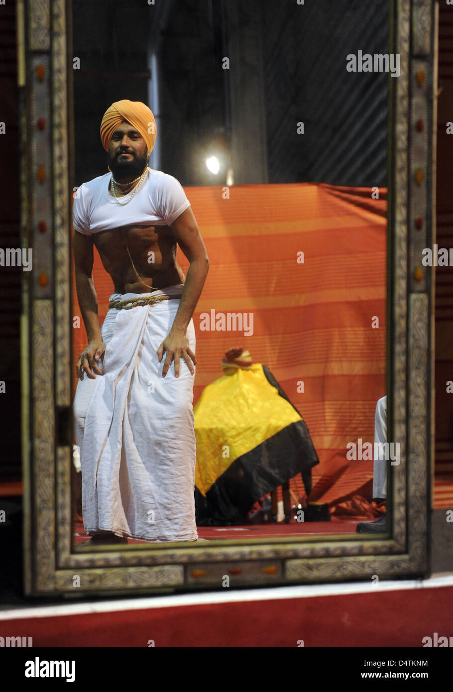 An Indian yogi master practices in front of a mirror during rehearsals ...