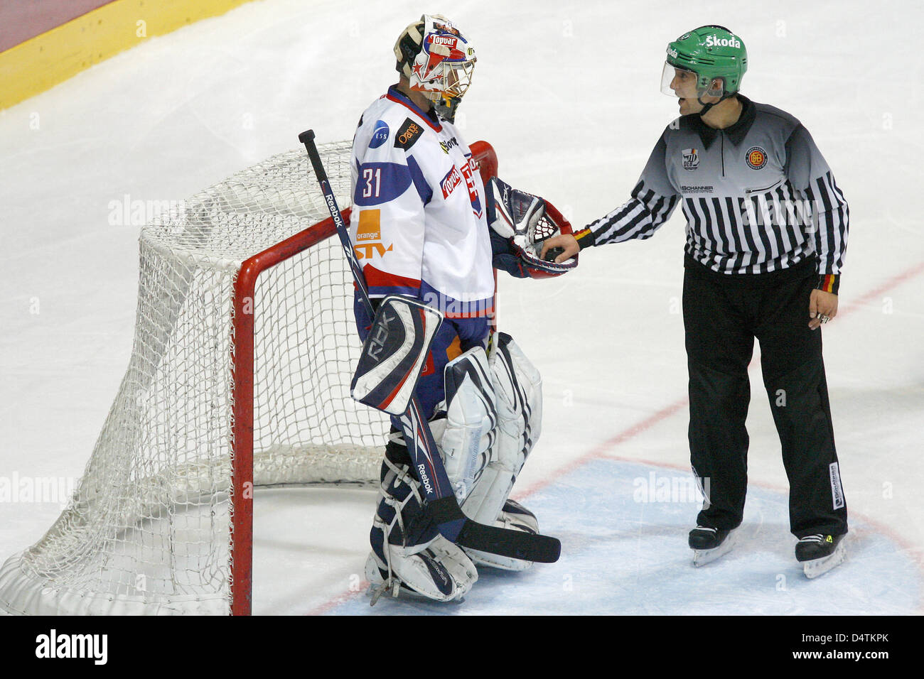 Slovakia?s keeper Rastislav Stana hands the puck to the referee during ...