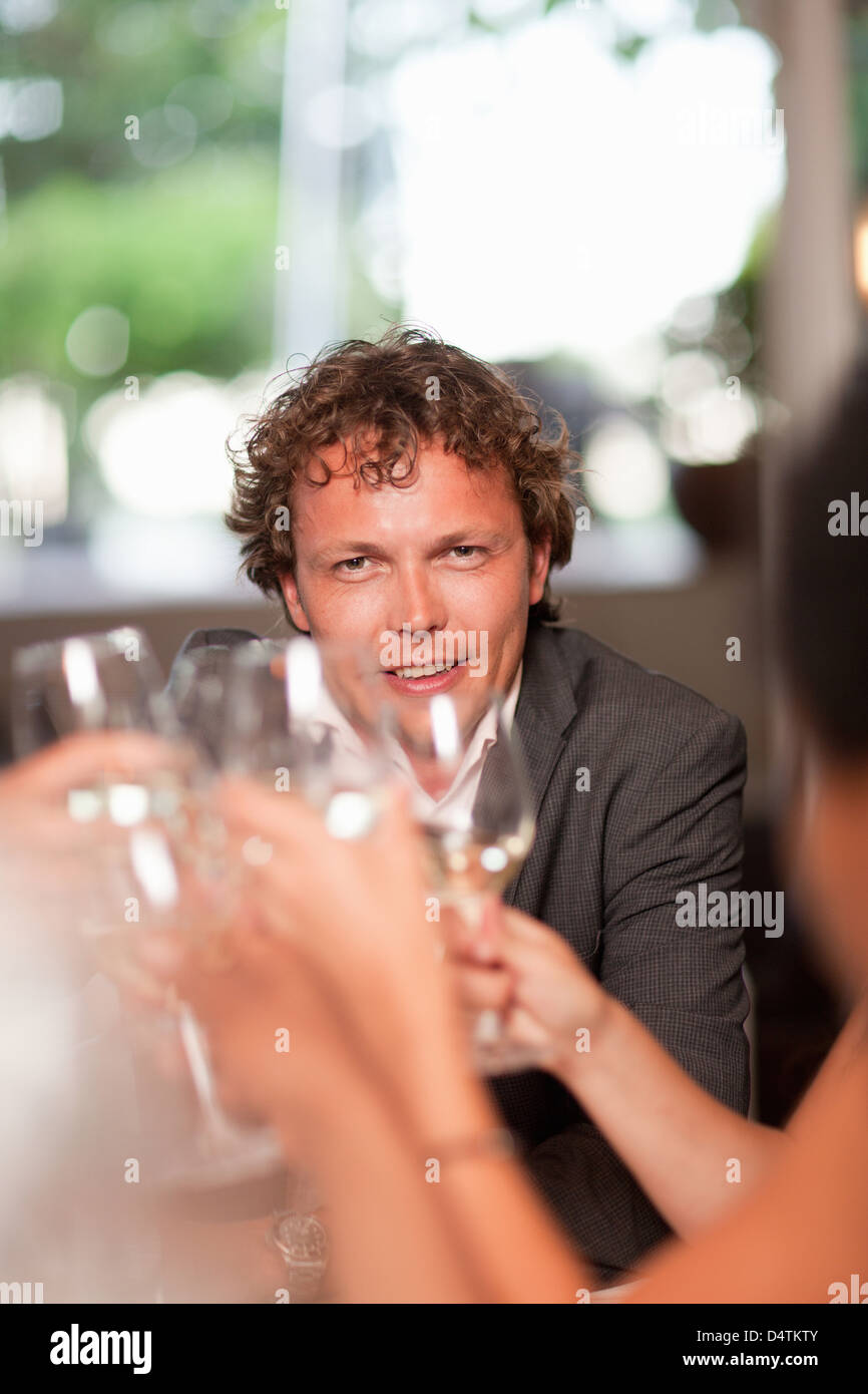Business people toasting in restaurant Stock Photo - Alamy