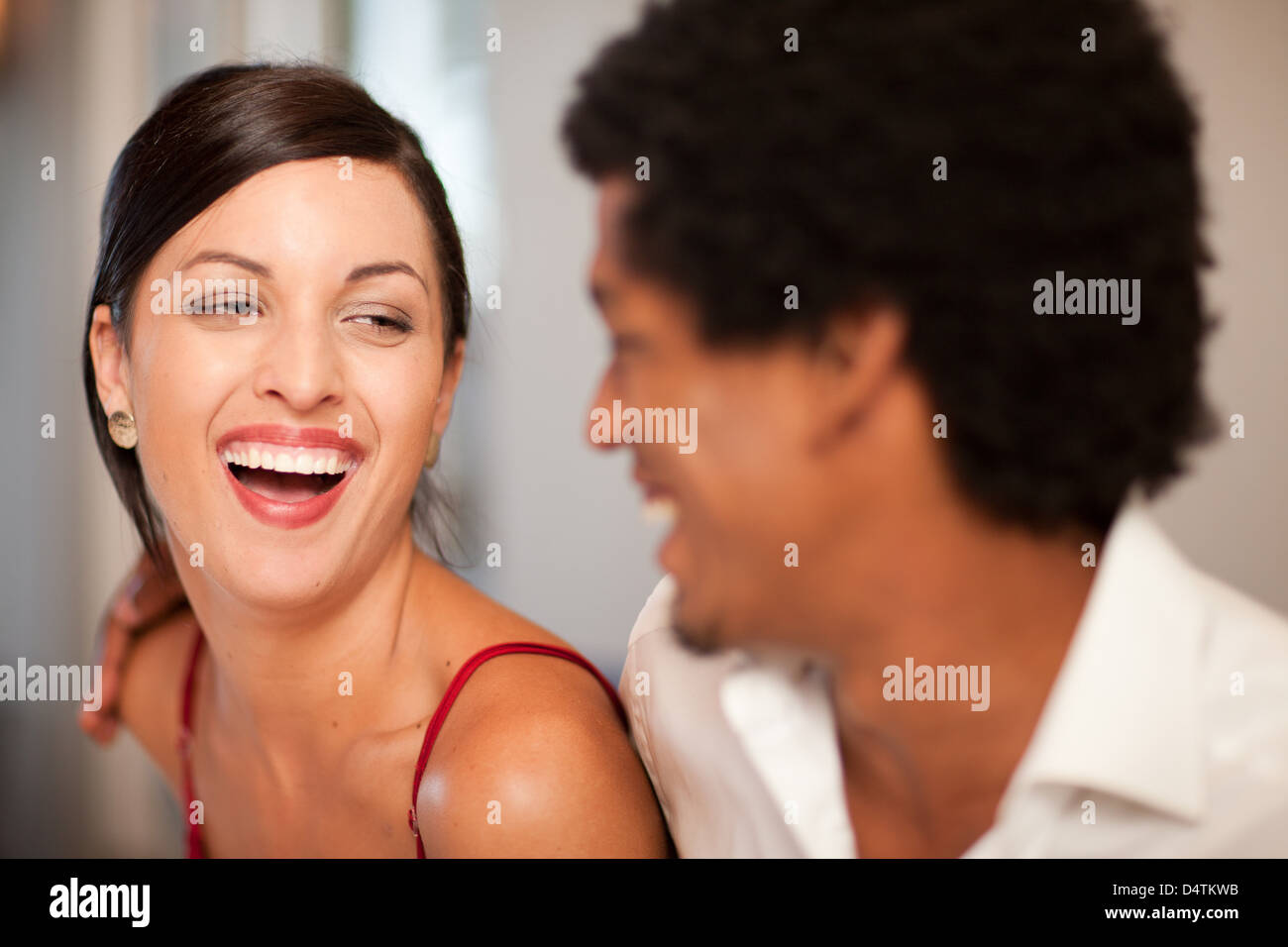 Couple laughing together Stock Photo - Alamy