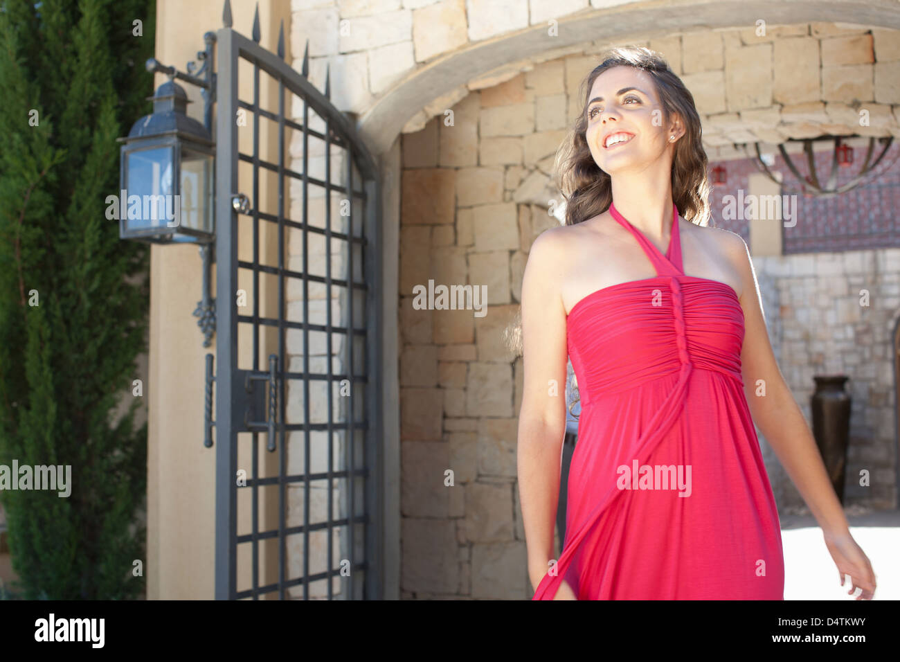 Smiling woman walking outdoors Stock Photo - Alamy