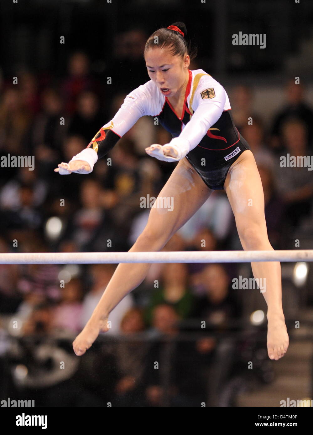 German Kim Bui performs on the uneven bars during the athletics world ...