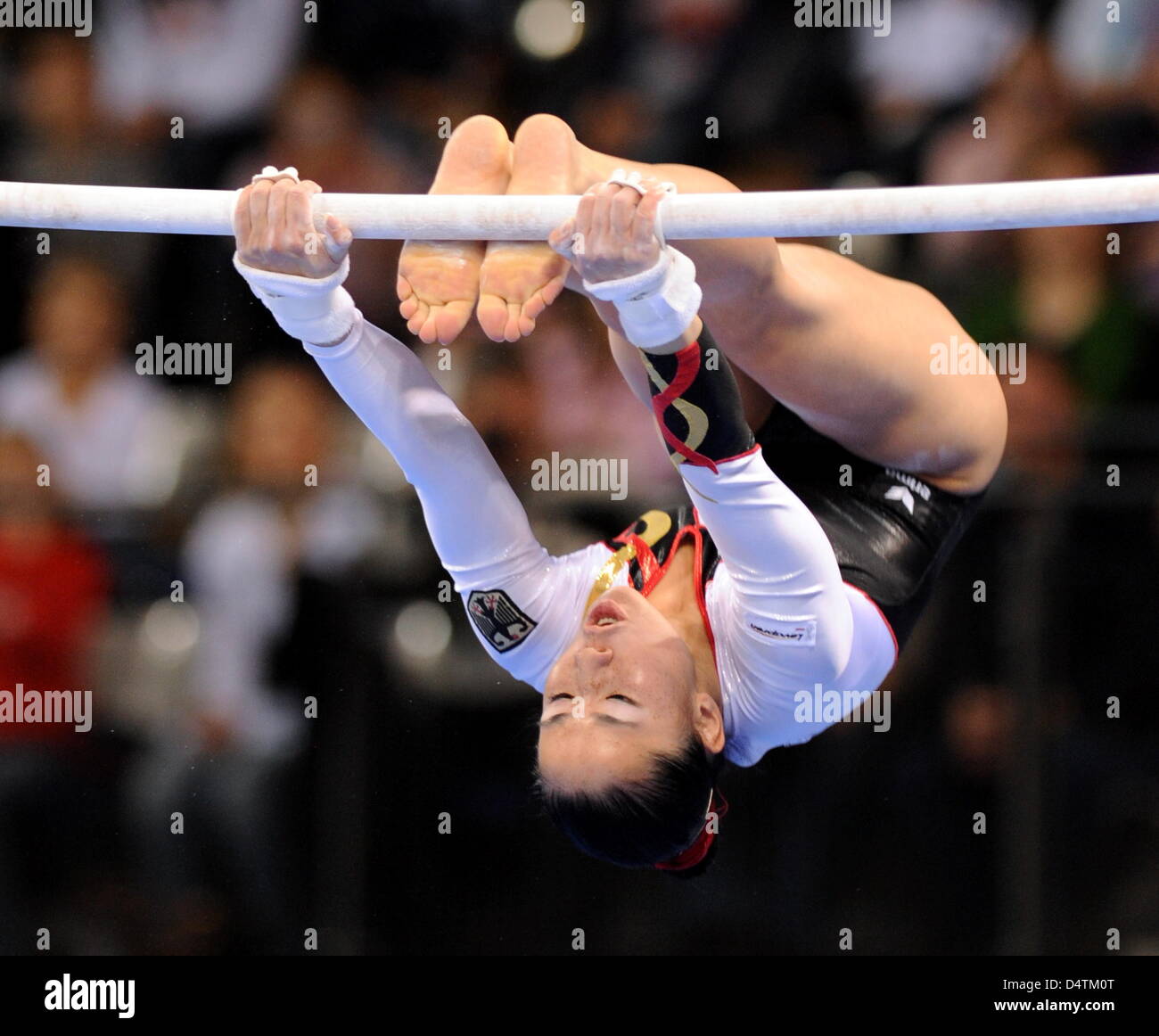 German Kim Bui performs on the uneven bars during the athletics world ...