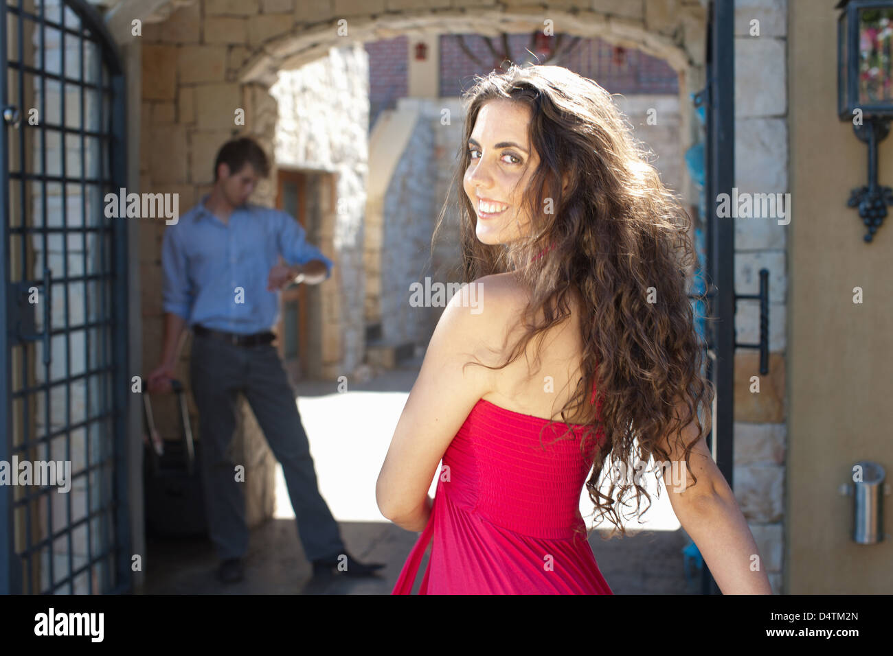 Smiling woman walking outdoors Stock Photo - Alamy