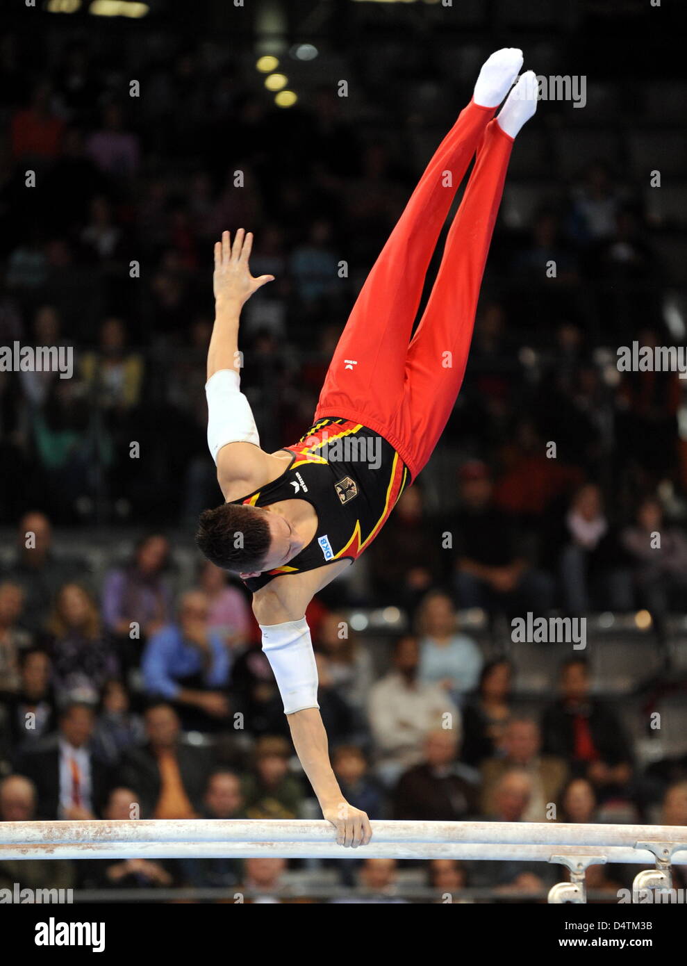 German Marcel Nguyen performs on the parallel bars during the athletics ...