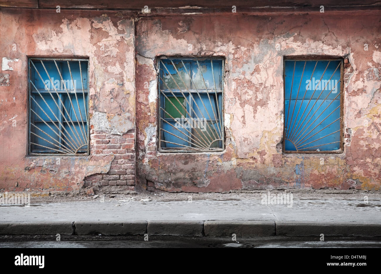 Old abandoned building wall texture with blue windows Stock Photo - Alamy