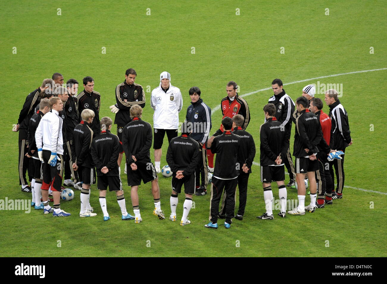 Germany?s national coach Joachim Loew (C) talks to his team prior to ...