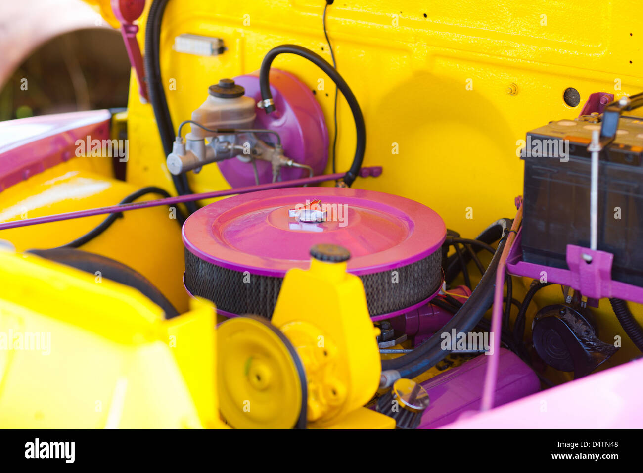 Close up of purple car engine Stock Photo - Alamy